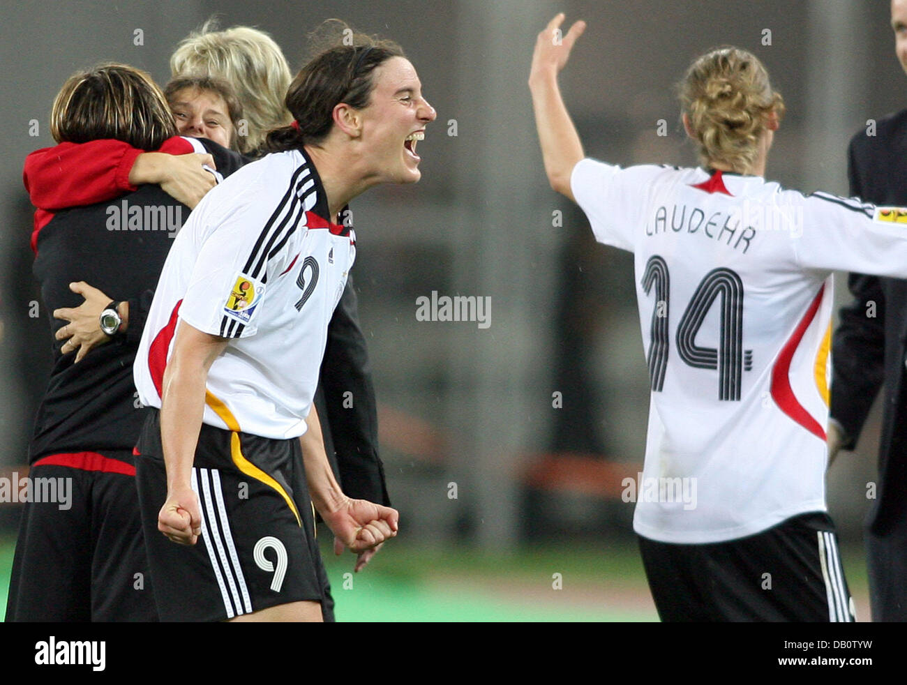 Germany's Birgit Prinz (L) and Kerstin Stegemann (R) cheer after the 3 ...