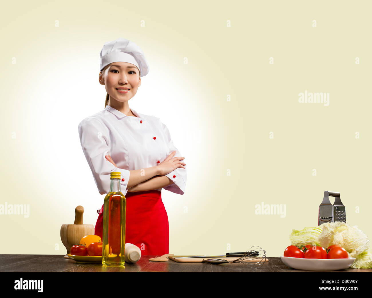 Asian cook woman crossed her arms Stock Photo - Alamy