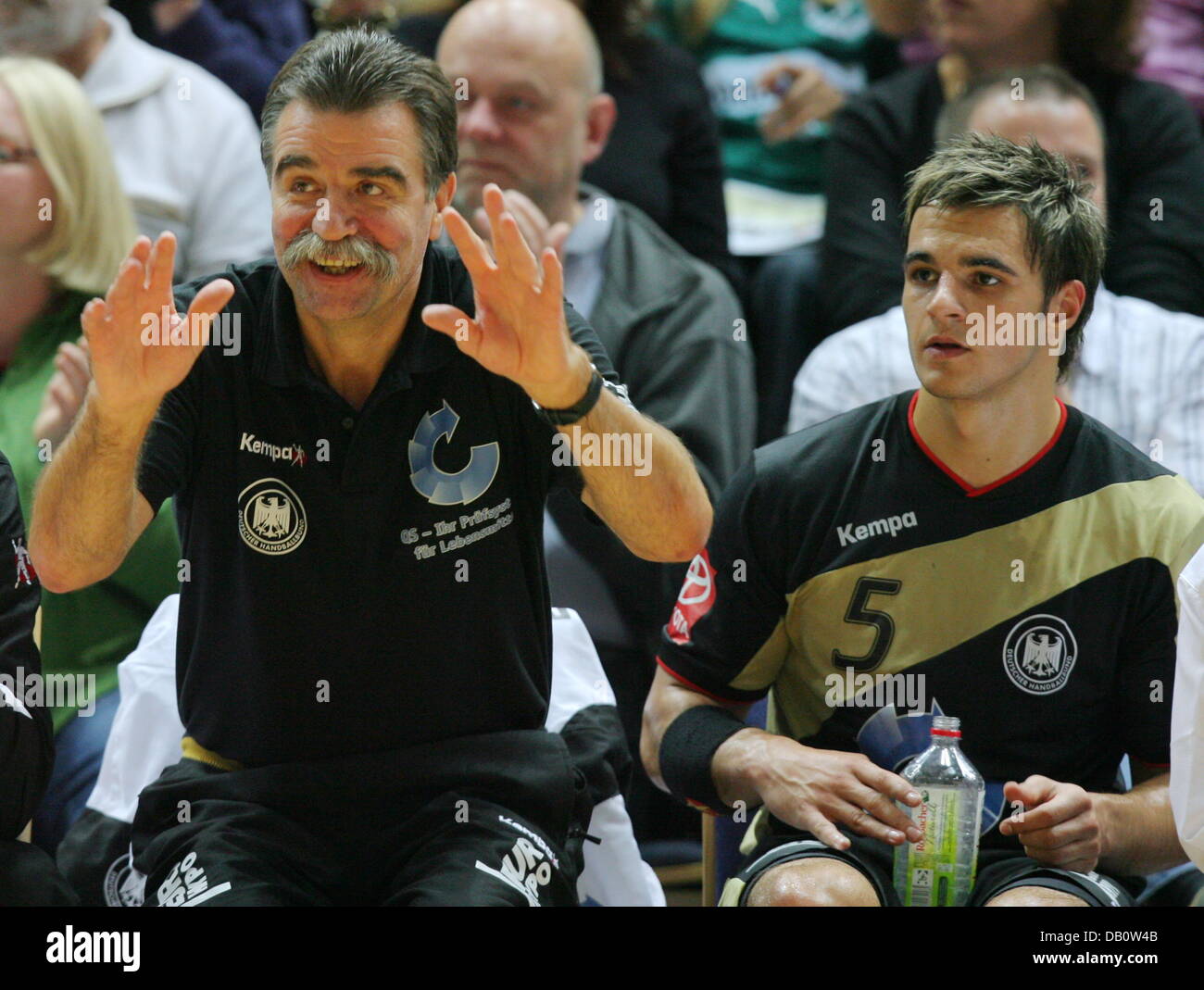 Germany head coach Heiner Brand (L) gestures during the match Germany v ...
