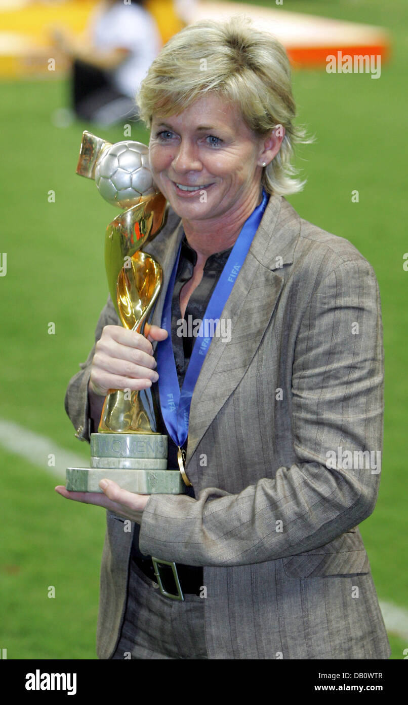 National coach Silvia Neid shows the cup after the German team's ...