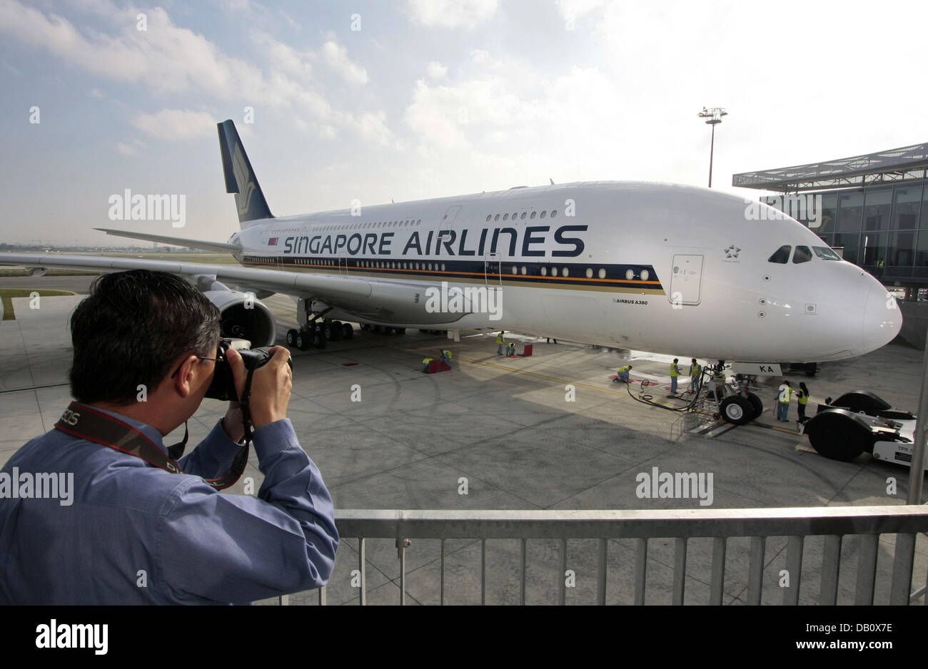 A photographer takes picture of the new super airbus A380 during its ...