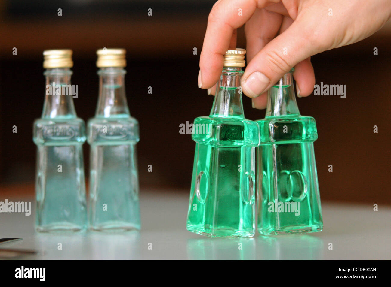 The picture shows two bluish absinthe bottles (L) for export to Canada ...