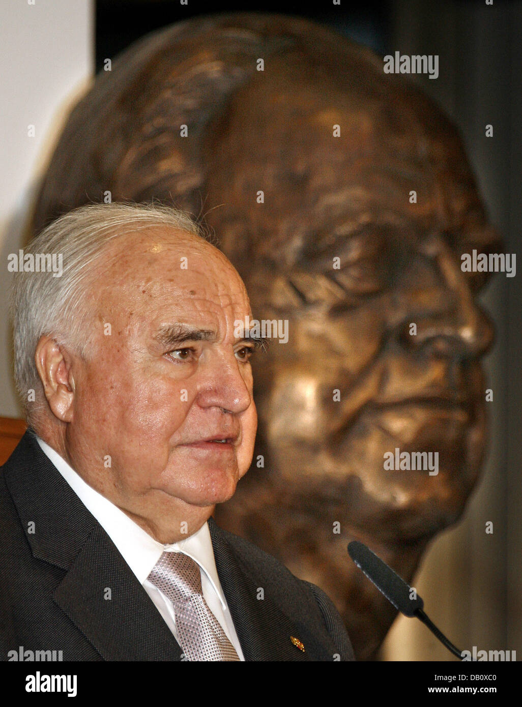 Former German Chancellor Helmut Kohl is pictured beside an oversized ...