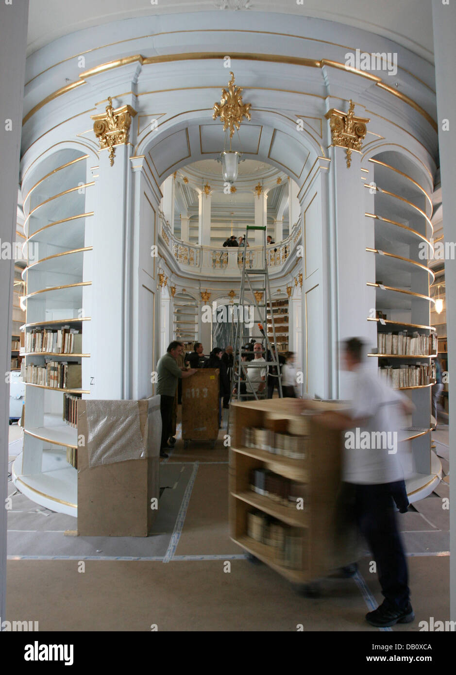 Employees re-arrange books in the shelves of the Duchess Anna Amalia ...
