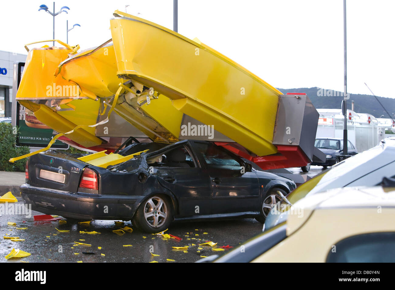A collapsed McDonald's advertising panel crushes a vehicle in Palma de ...