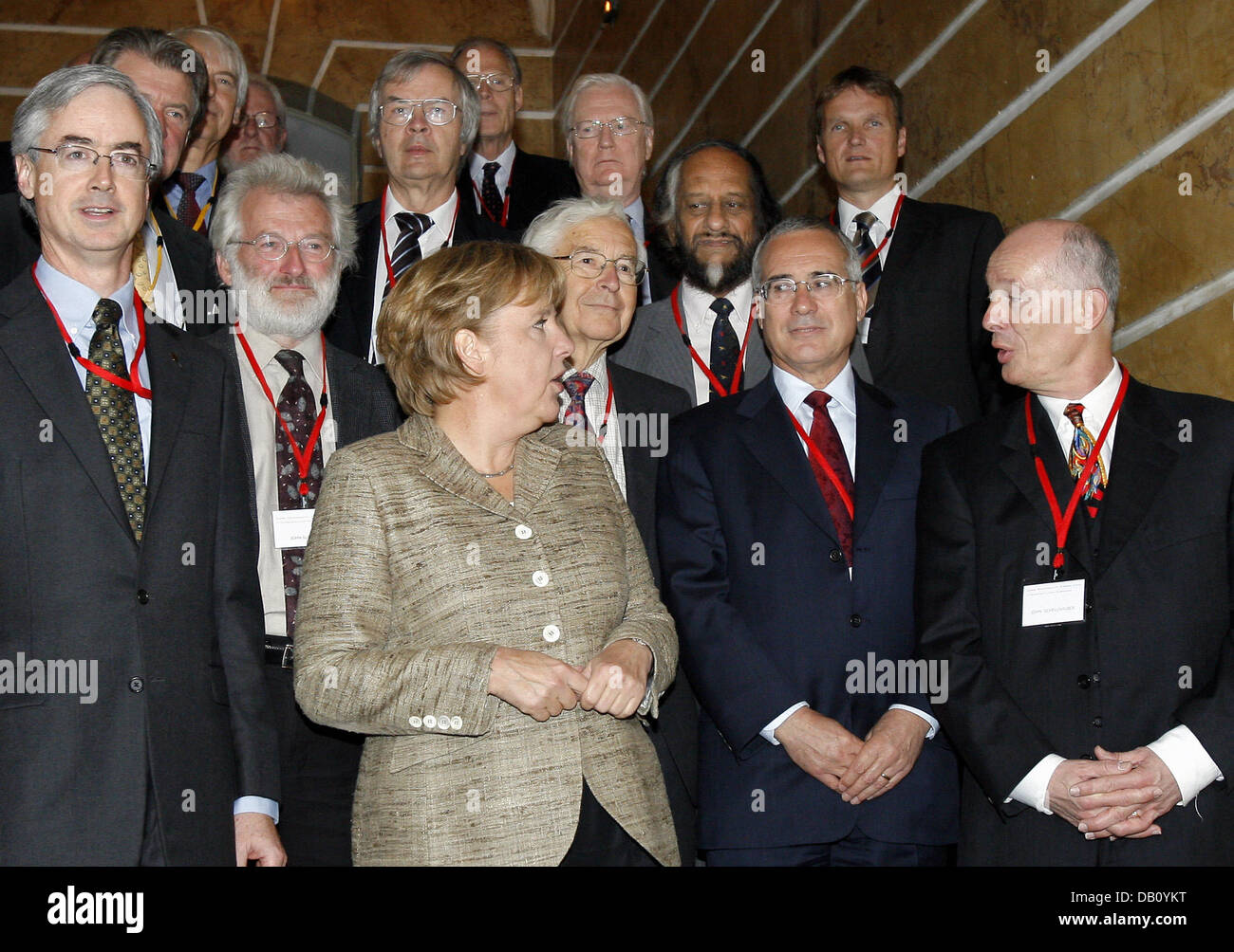 German Chancellor Angel Merkel (C) poses with the attendees of the two ...
