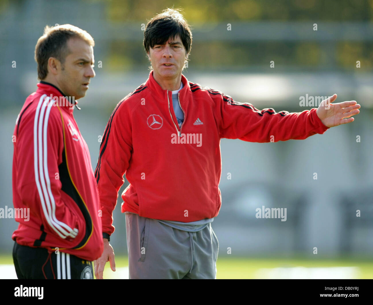 The coach of the German national team Joachim Loew (L) talks with his ...