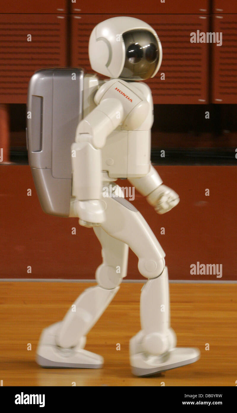 An Asimo roboter developed by Honda walks through a lecture hall at the ...