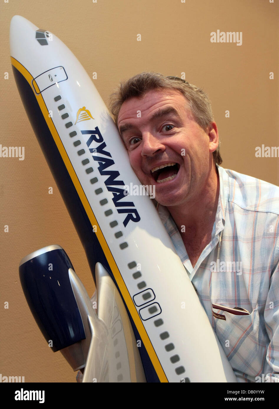 Michael O'Leary, CEO of low-cost airline Ryanair, poses with a model of ...
