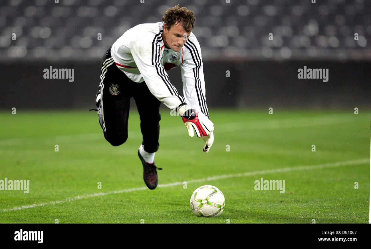 Goalkeeper of the German national team, Jens Lehmann, reaches for the ...