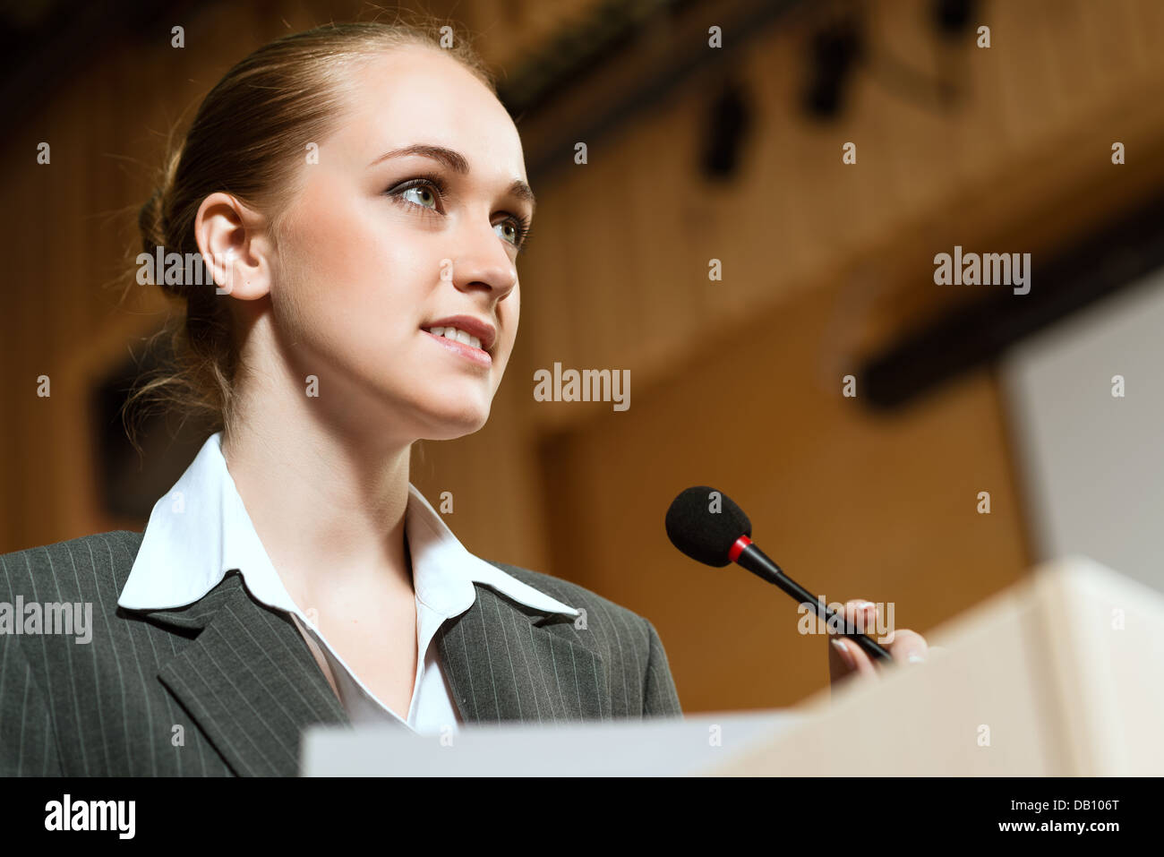 Portrait of a business woman with microphone Stock Photo - Alamy