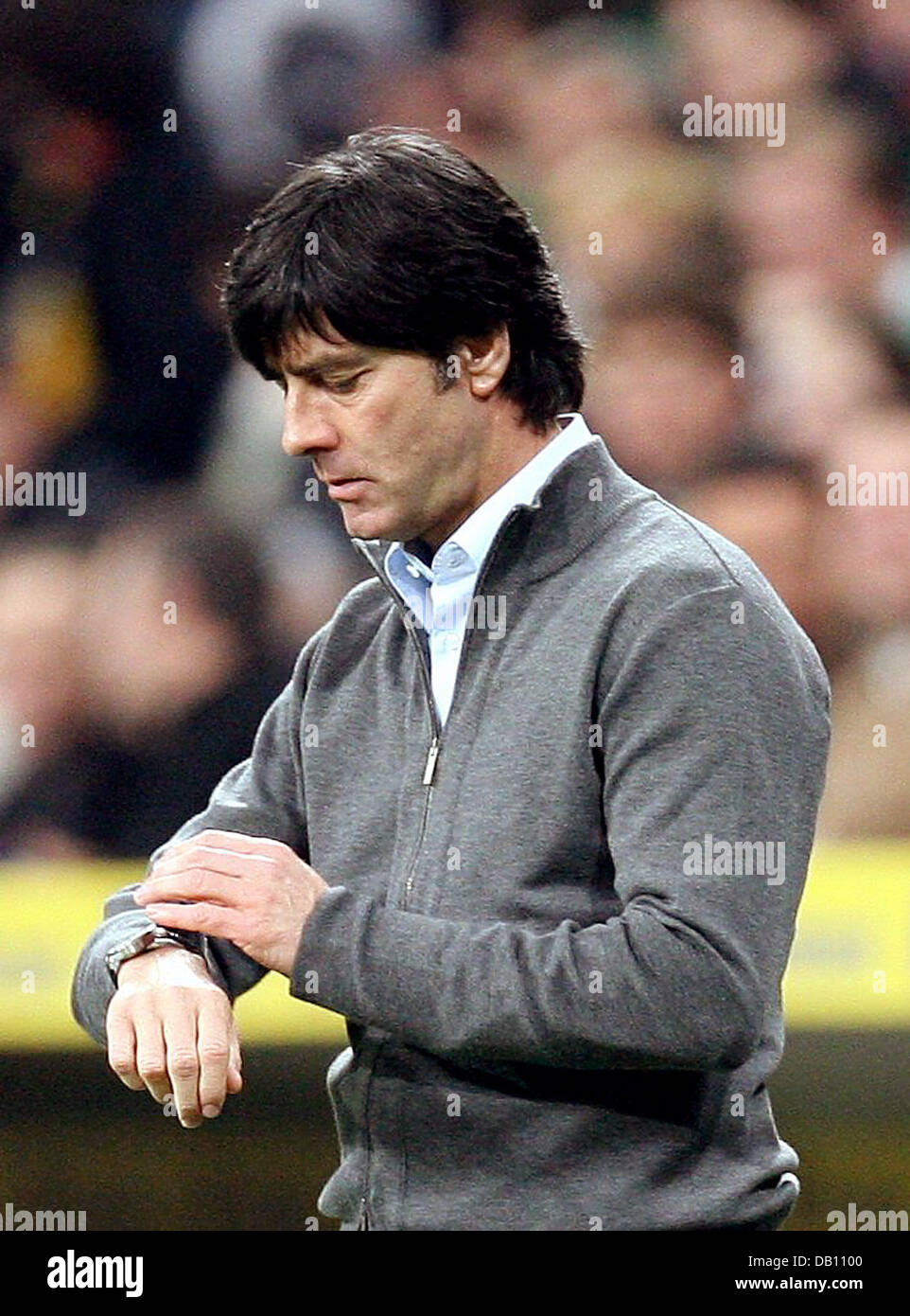 German national soccer coach Joachim Loew checks the time during the ...