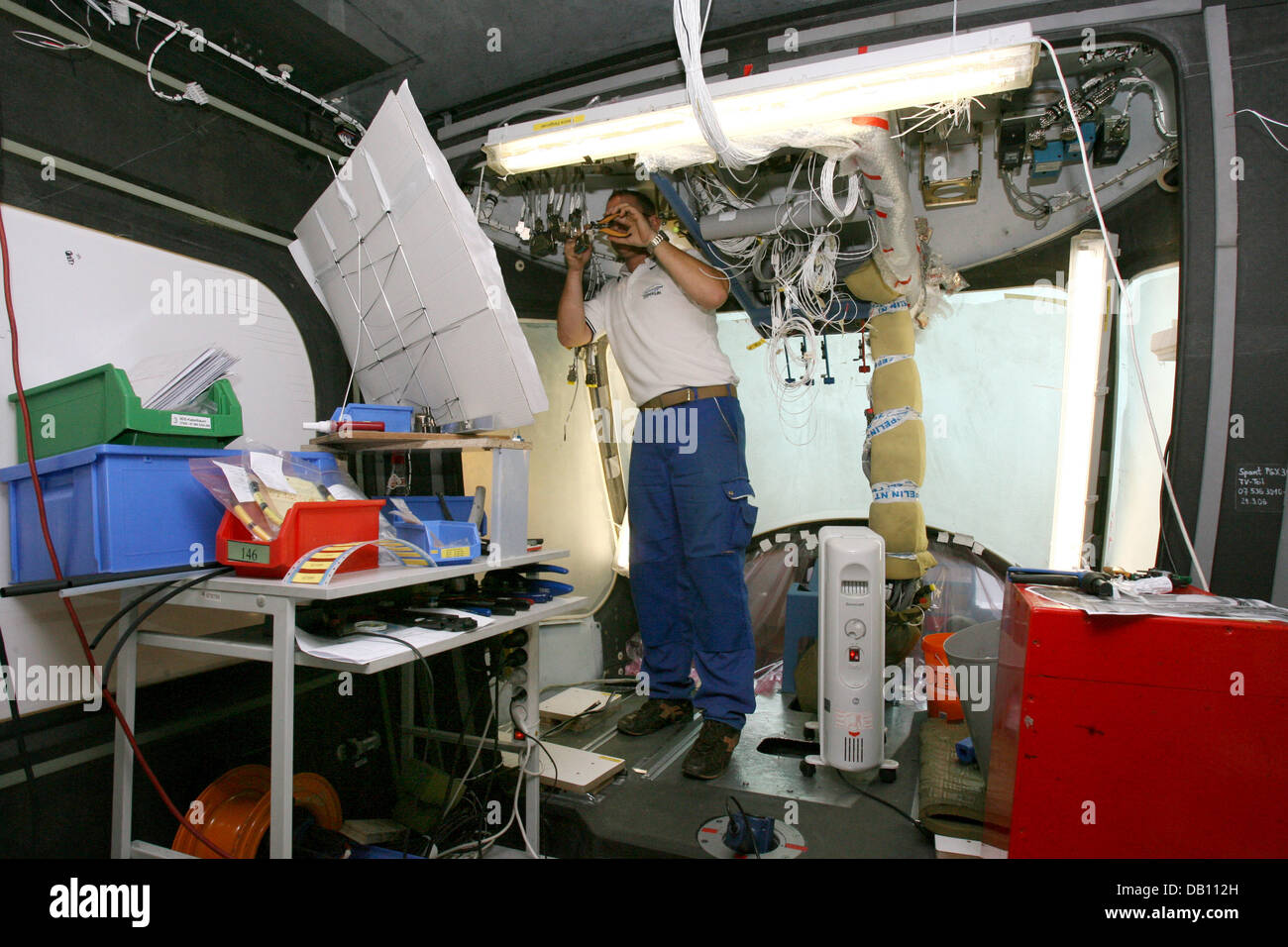 An employee of 'Zeppelin Luftschifftechnik Ltd.' (ZLT) works inside the ...