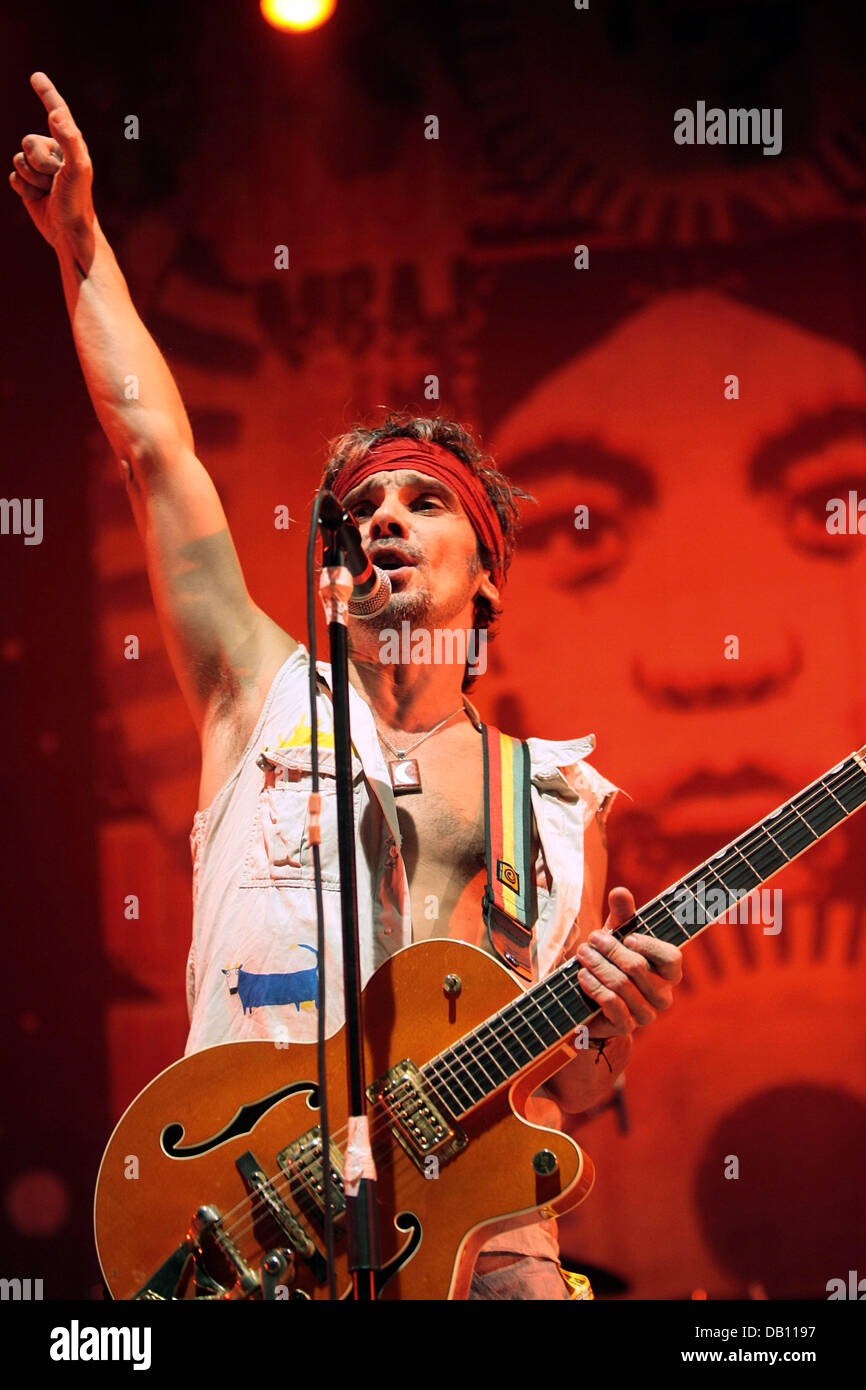 French-born musician Manu Chao cheers the crowd during his show in ...