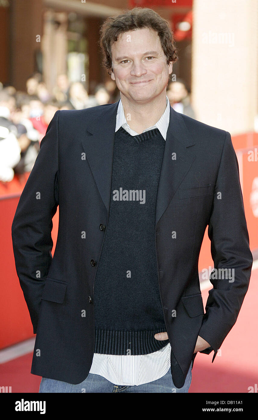 British actor Colin Firth smiles for the cameras as he arrives for a ...