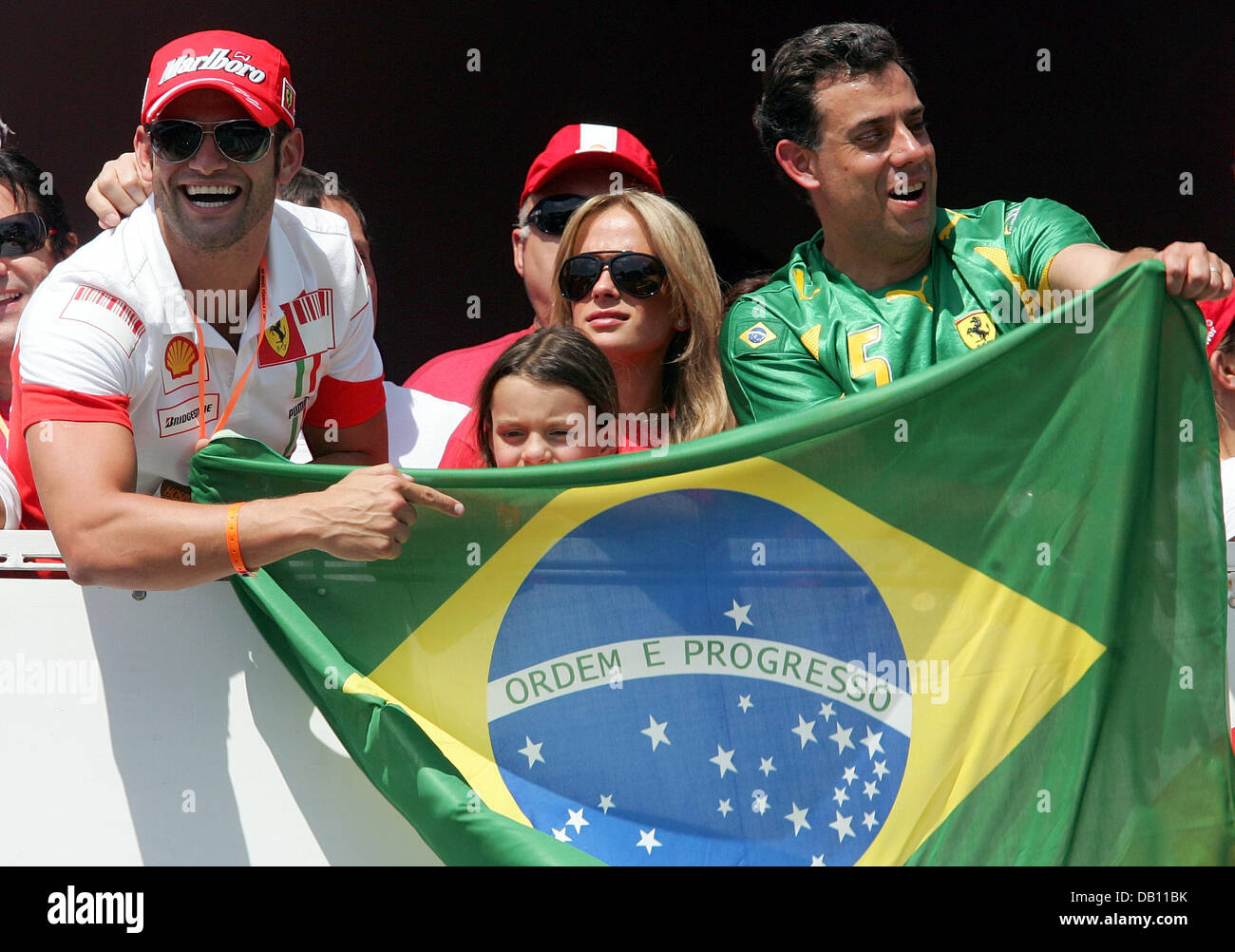 Brazilian Formula One fans hold a Brazilian flag after Brazilian ...
