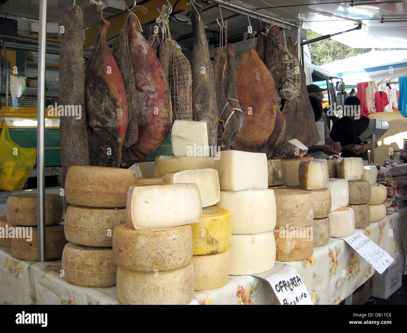 The picture shows a cheese and ham stand on a market in Sardinian Olbia ...