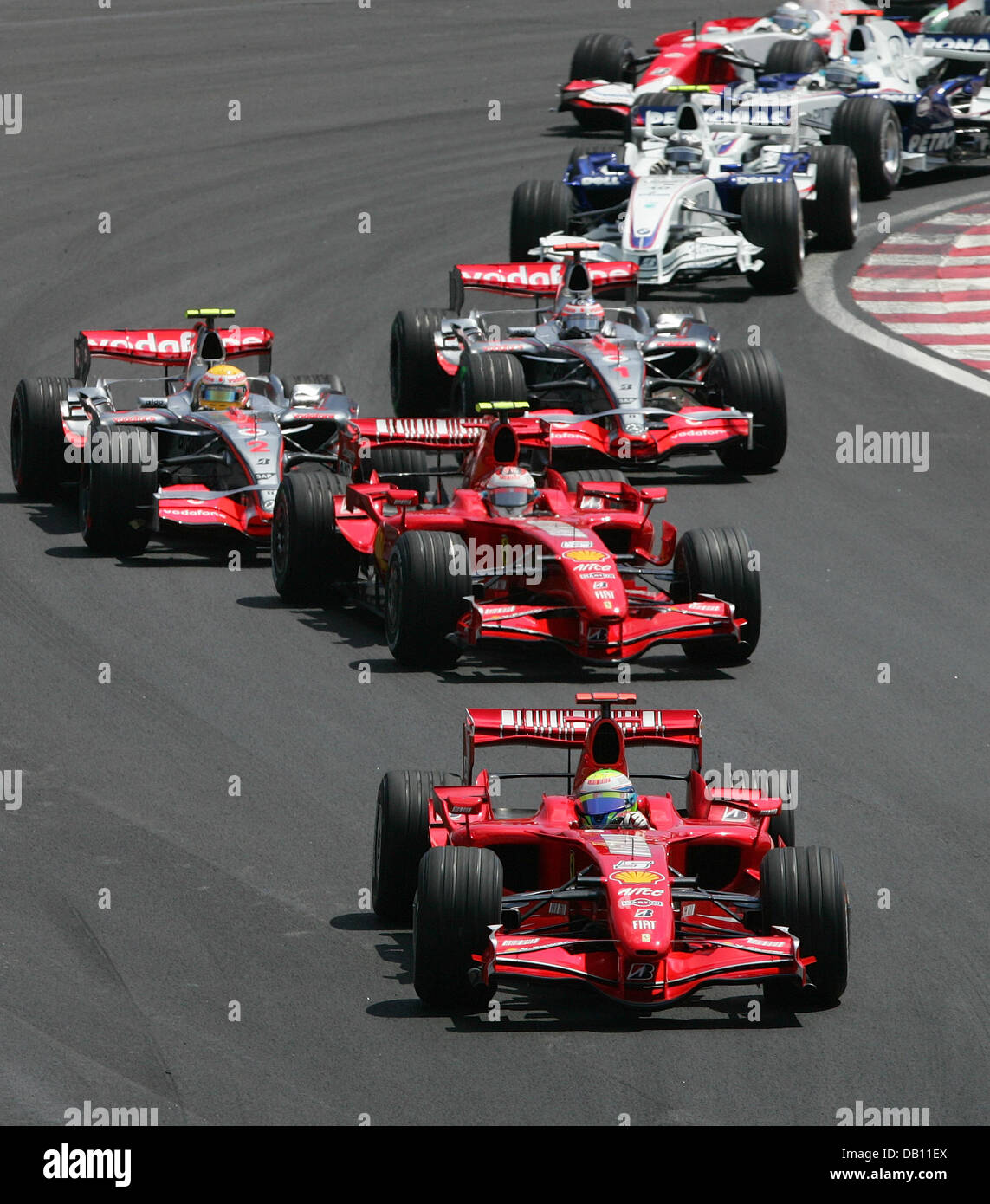 Brazilian Formula One driver Felipe Massa leads the pack ahead of his ...