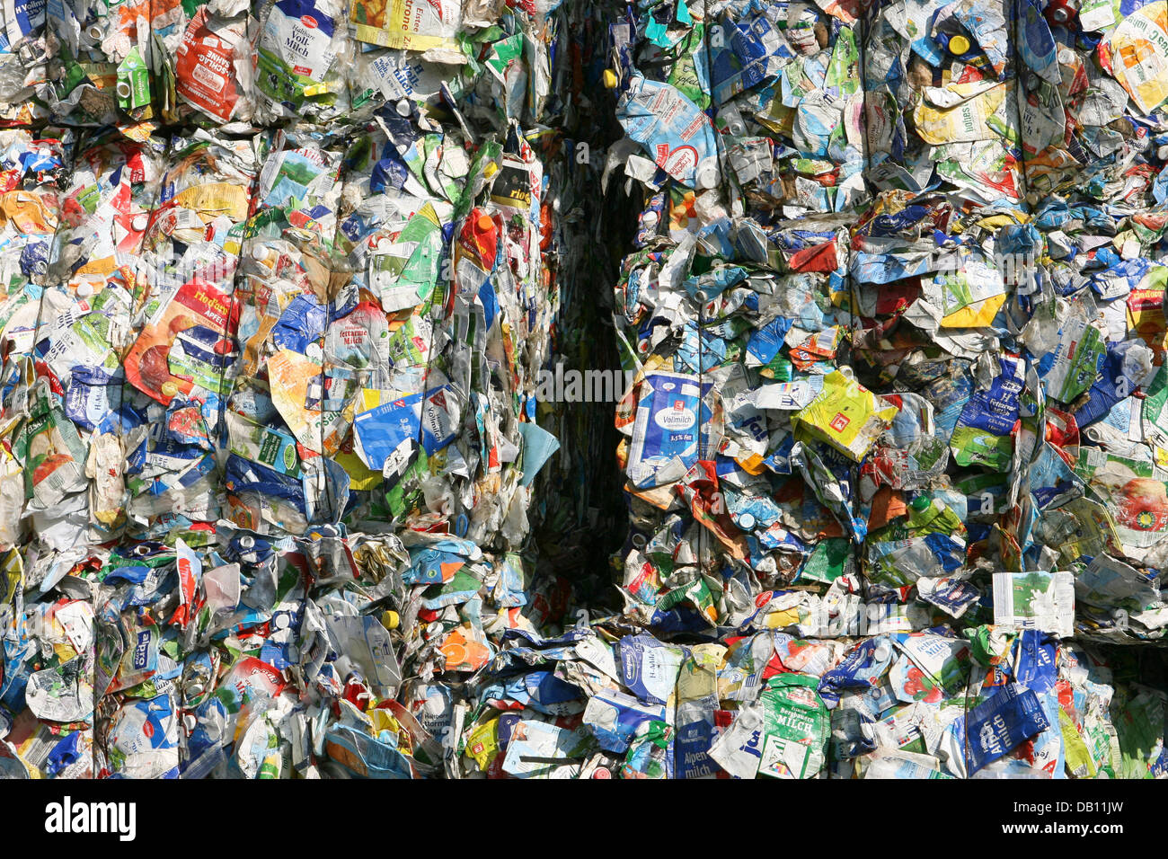 Bales of pressed packaging board are stacked at the premises of a paper ...