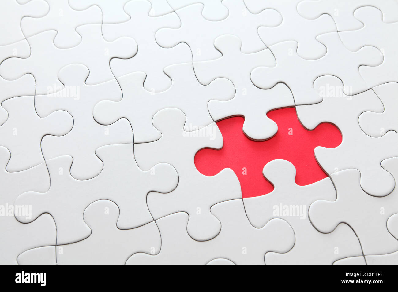 puzzle with missing red piece Stock Photo - Alamy