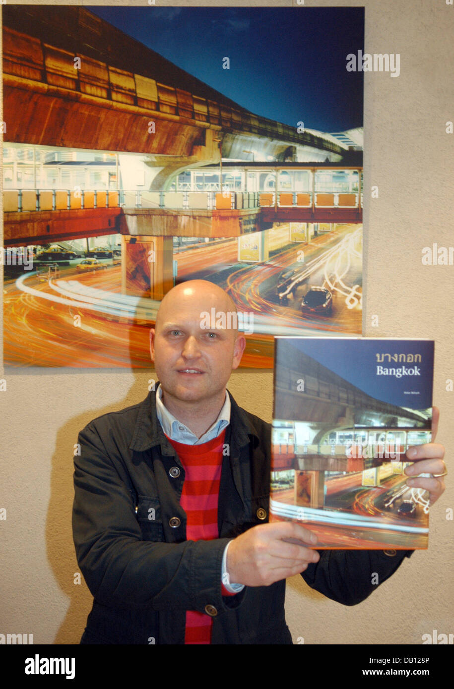 Photographer Peter Nitsch poses with his new illustrated book ?Bangkok? at bookshop ?Literatur ...