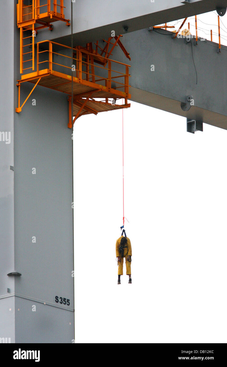 The killed worker is lowered with a rope following a severe accident at ...