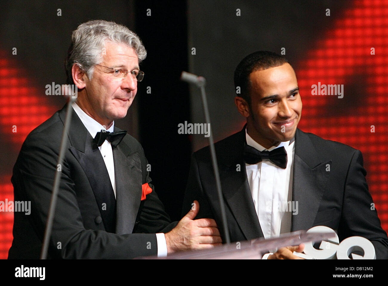 Sports moderator Marcel Reif (L) is the laudator for English Formula ...
