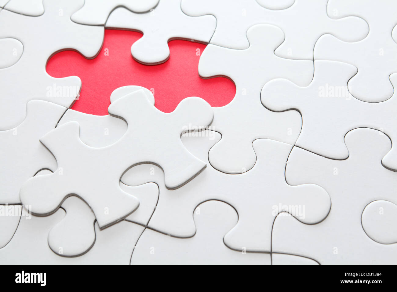 puzzle with missing red piece Stock Photo - Alamy