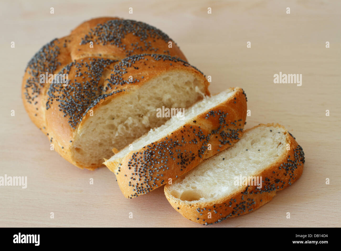 Sliced challah bread on wooden board Stock Photo - Alamy