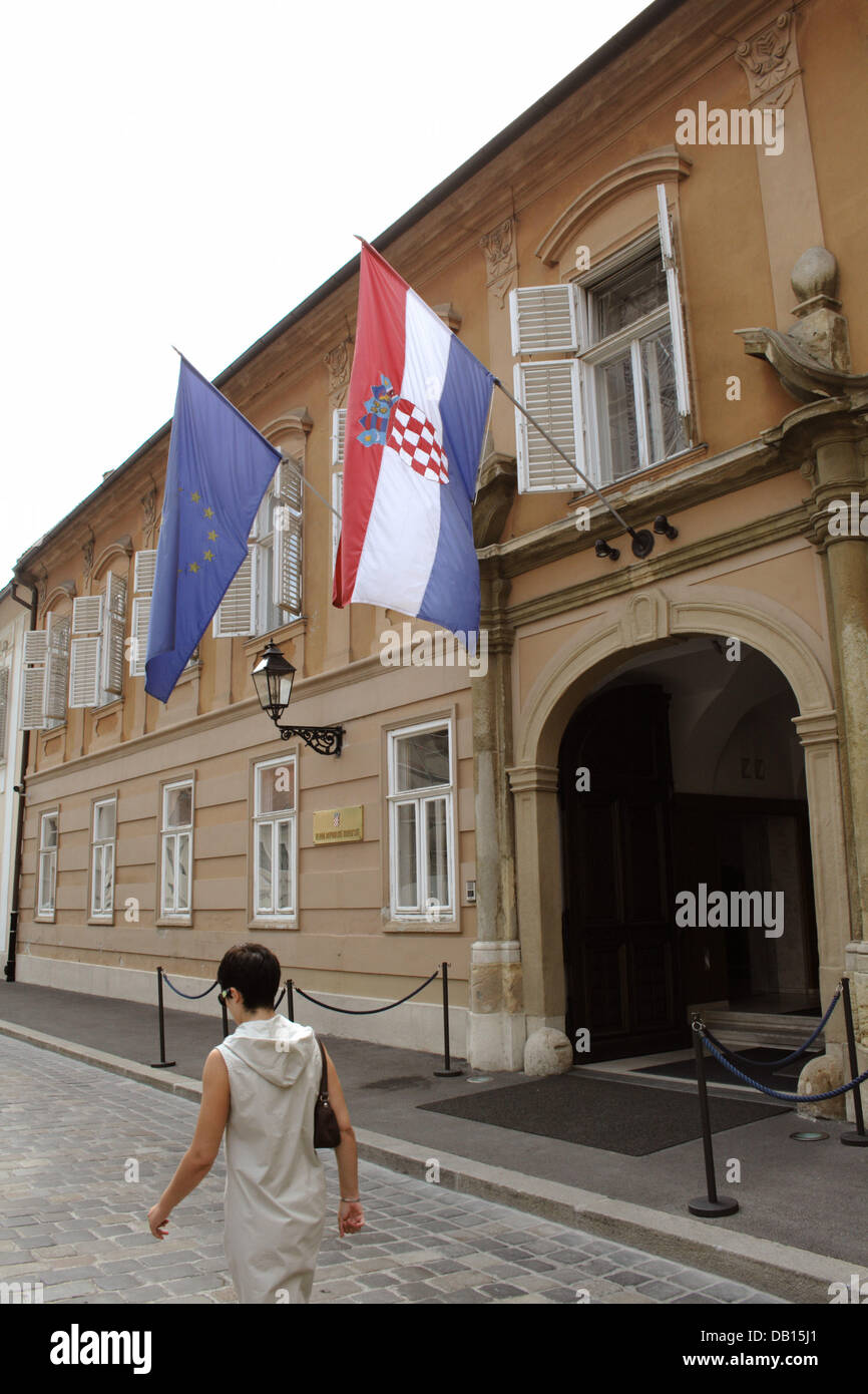 The Croatian (R) and the European (L) flag hang at the Vlada, seat of ...