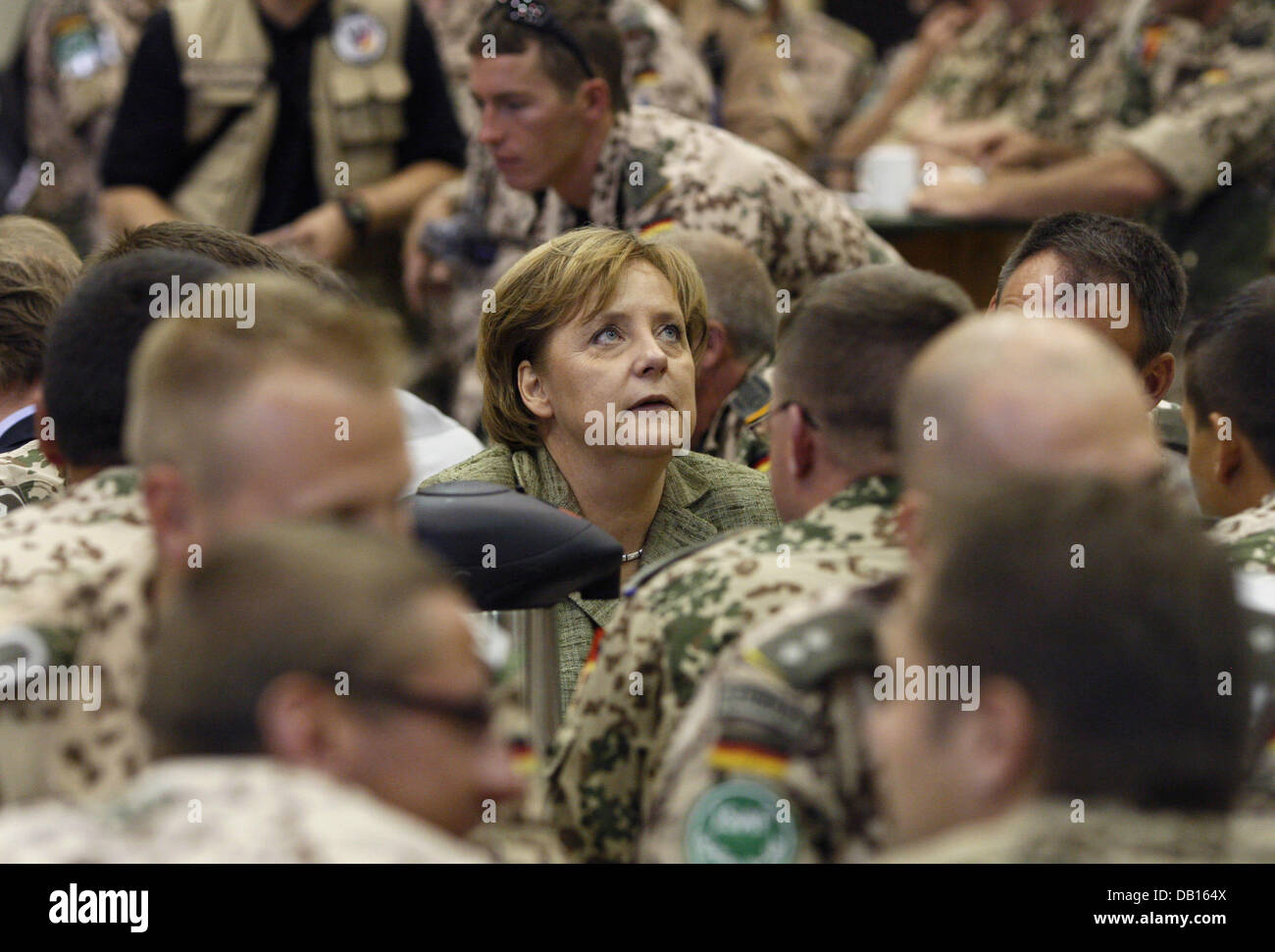 German Chancellor Angela Merkel speaks with German ISAF soldiers at ...