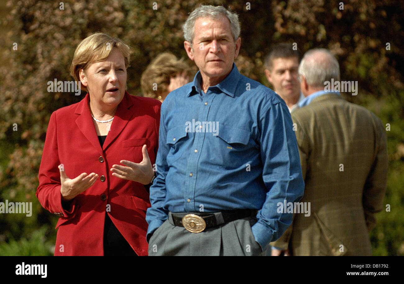 German Chancellor Angela Merkel talks to US President George W. Bush on ...