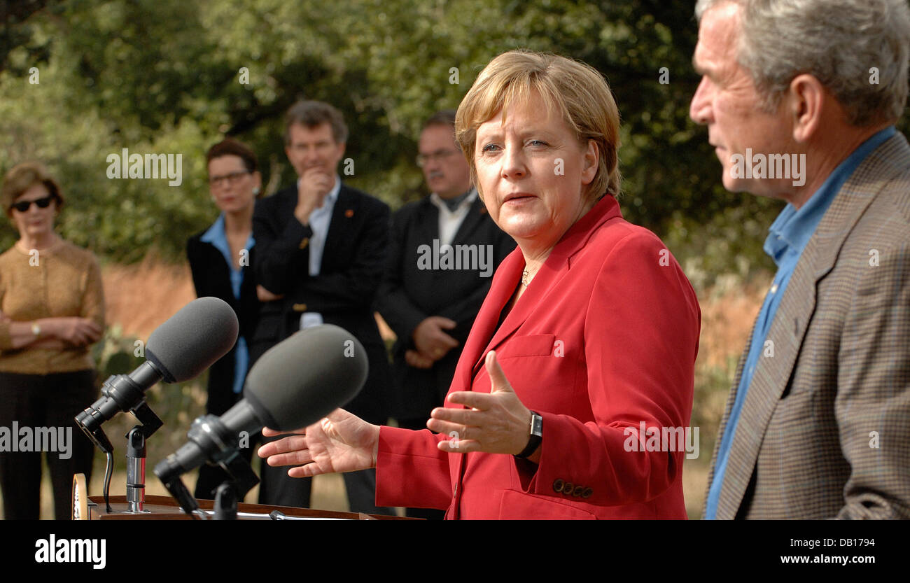 German Chancellor Angela Merkel and US President George W. Bush talk at ...