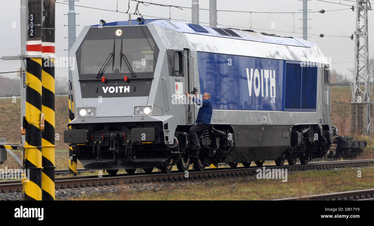 A man boards a Voith Maxima diesel engine on a test track in Velim ...