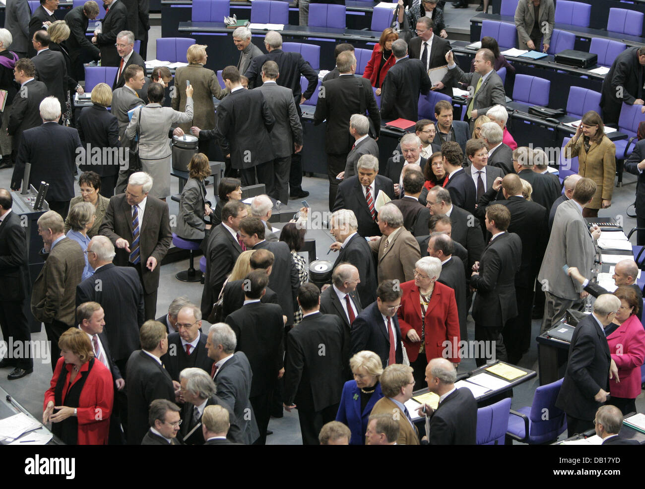Armed with their voting cards the members of the German parliament ...
