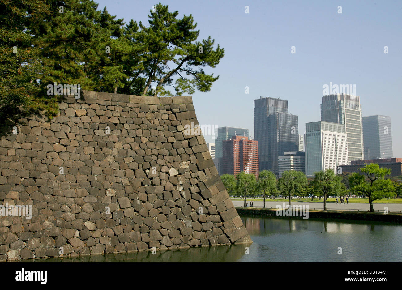 The Imperial Palace's outer wall is seen with modern high-rise ...