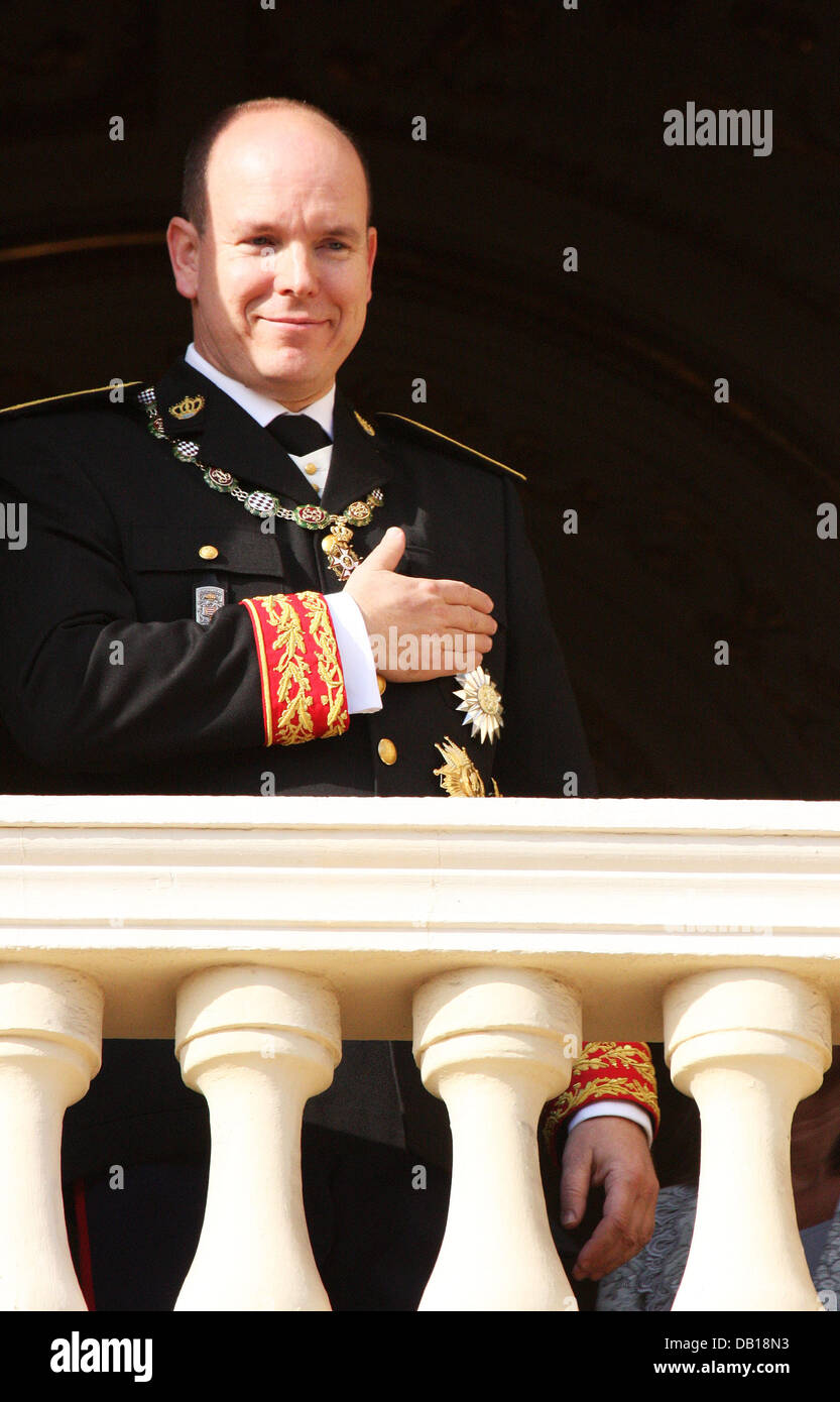 Prince Albert II of Monaco waves from the balcony attending a parade to ...