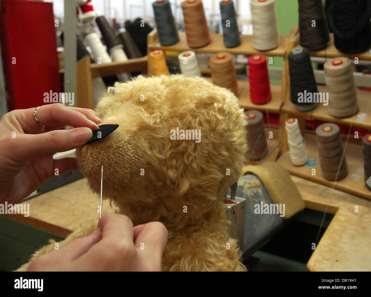 An employee of 'Steiff' prepares a teddy bear in Giegen, Germany, 21 ...