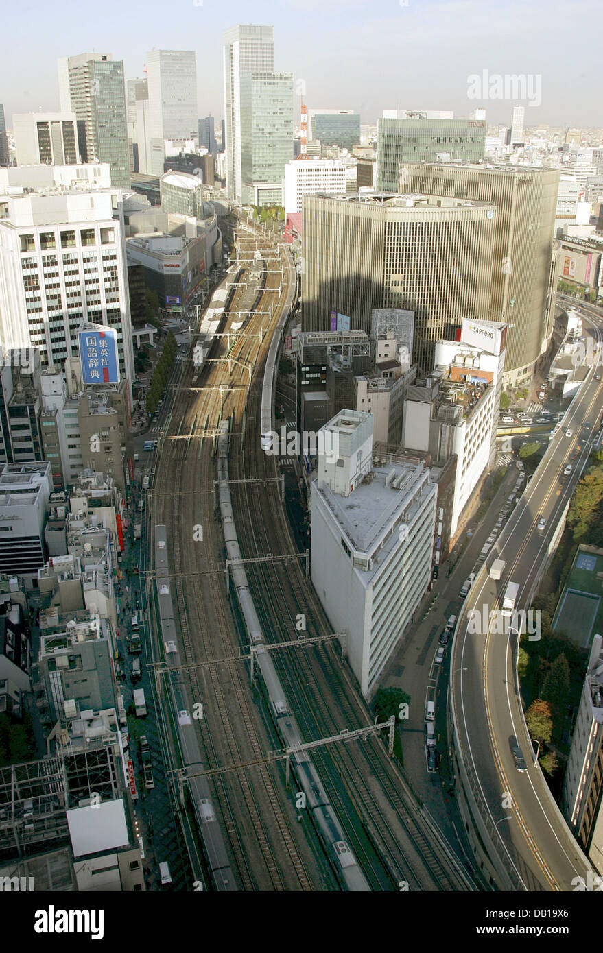 Railway tracks and large freeways serpent through the modern high ...