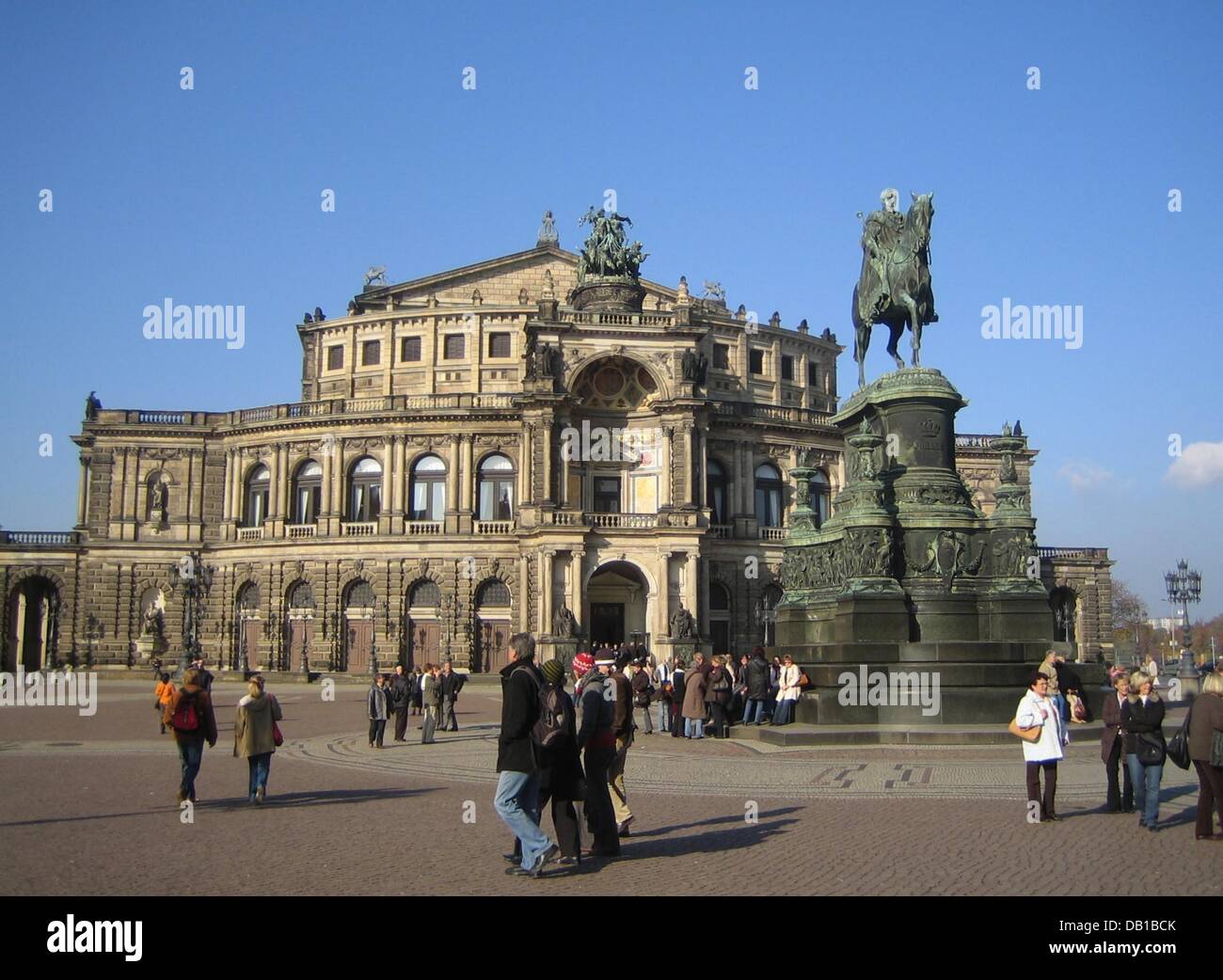 Tourists pass the monument of King John Friedrich of Saxonia-Weimar and ...