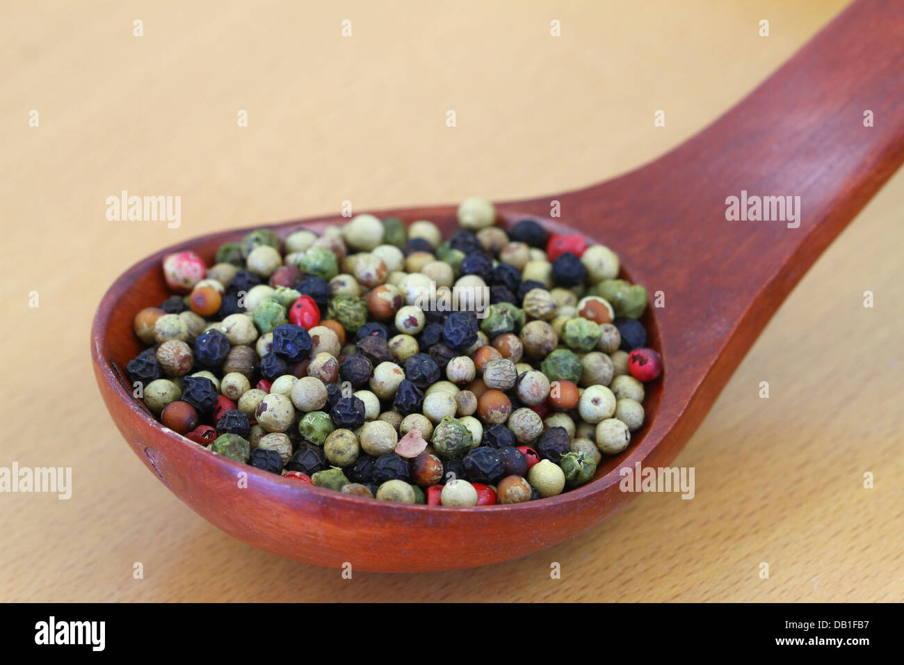 Black peppercorn on wooden spoon hi-res stock photography and images ...