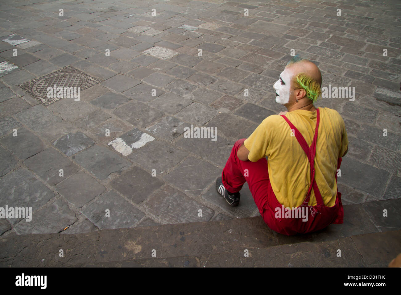 Clown taking a break from entertaining tourists on the streets of ...