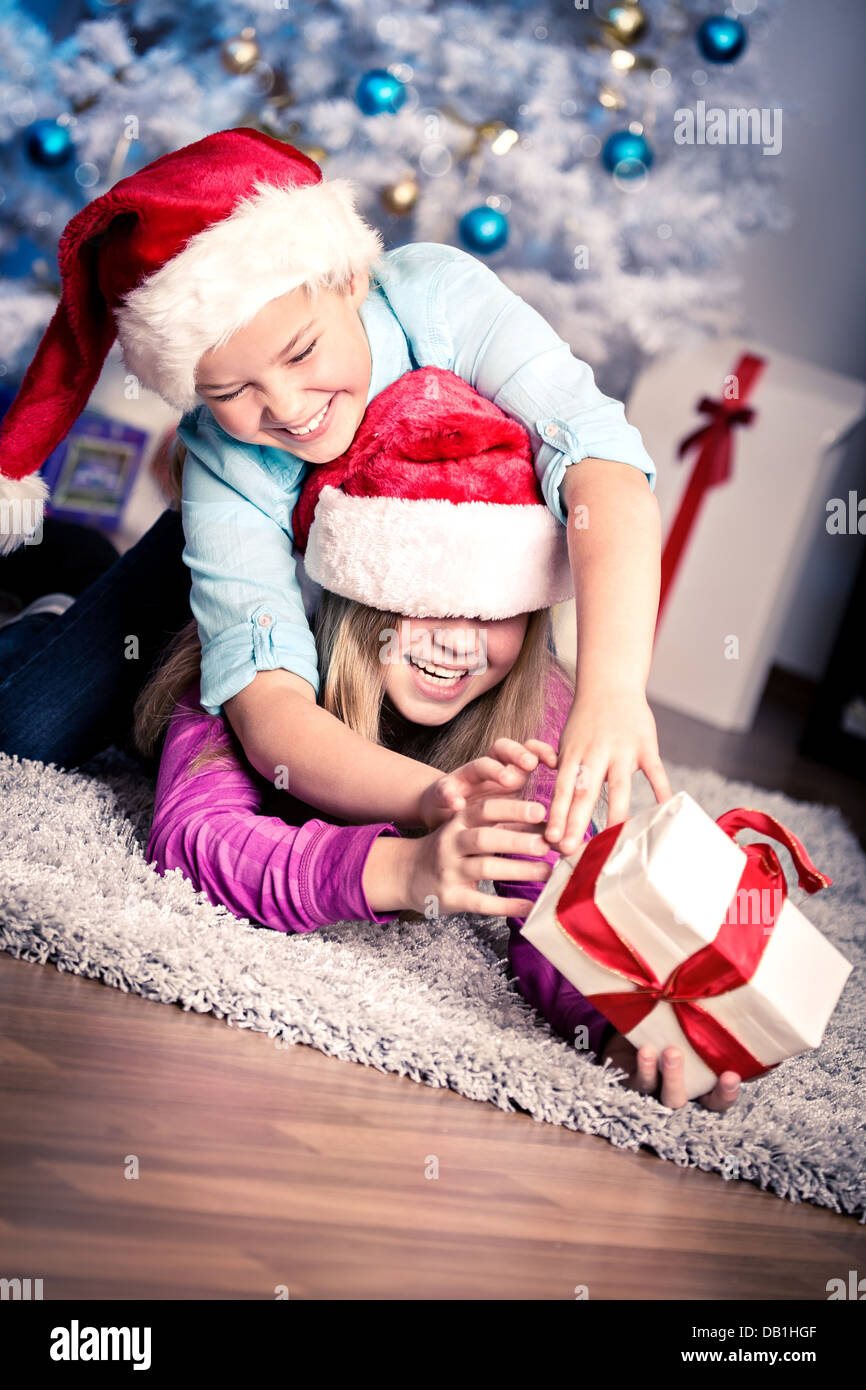 Child getting present christmas hi-res stock photography and images - Alamy
