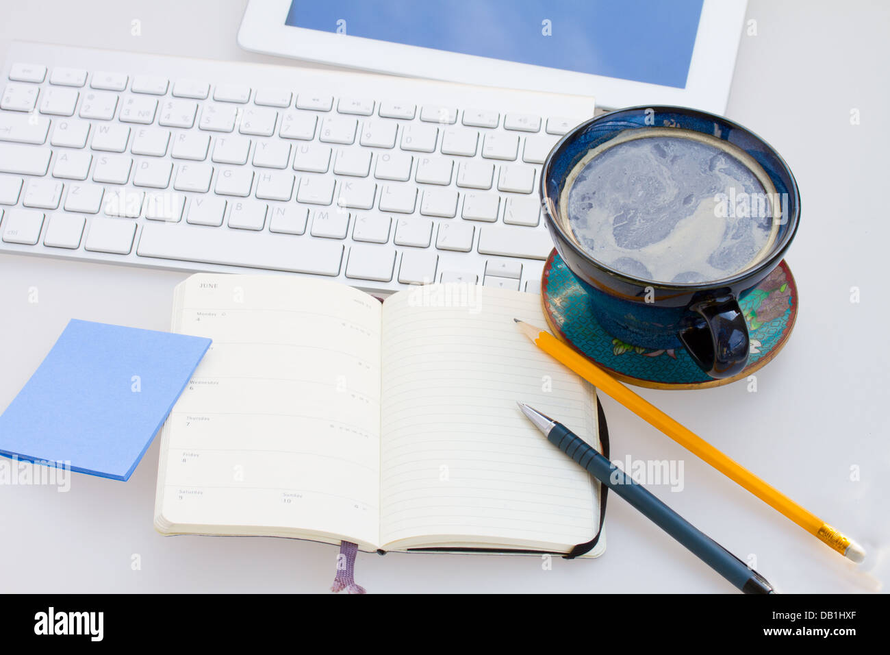 open note pad on working table Stock Photo - Alamy