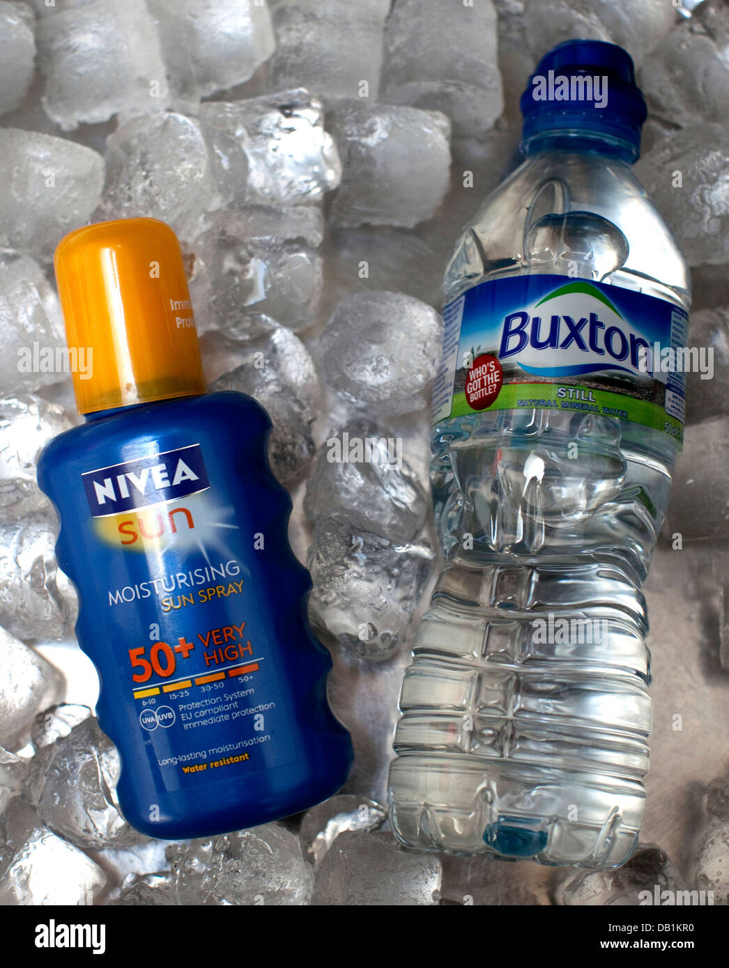 Items for coping with the heatwave, London: sun block & cold water ...