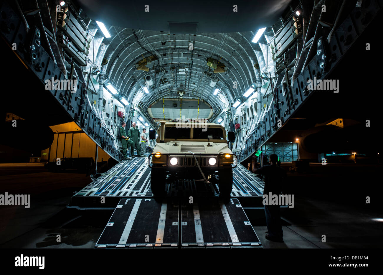 A Humvee is loaded onto a C-17 Globemaster III during an exercise to ...