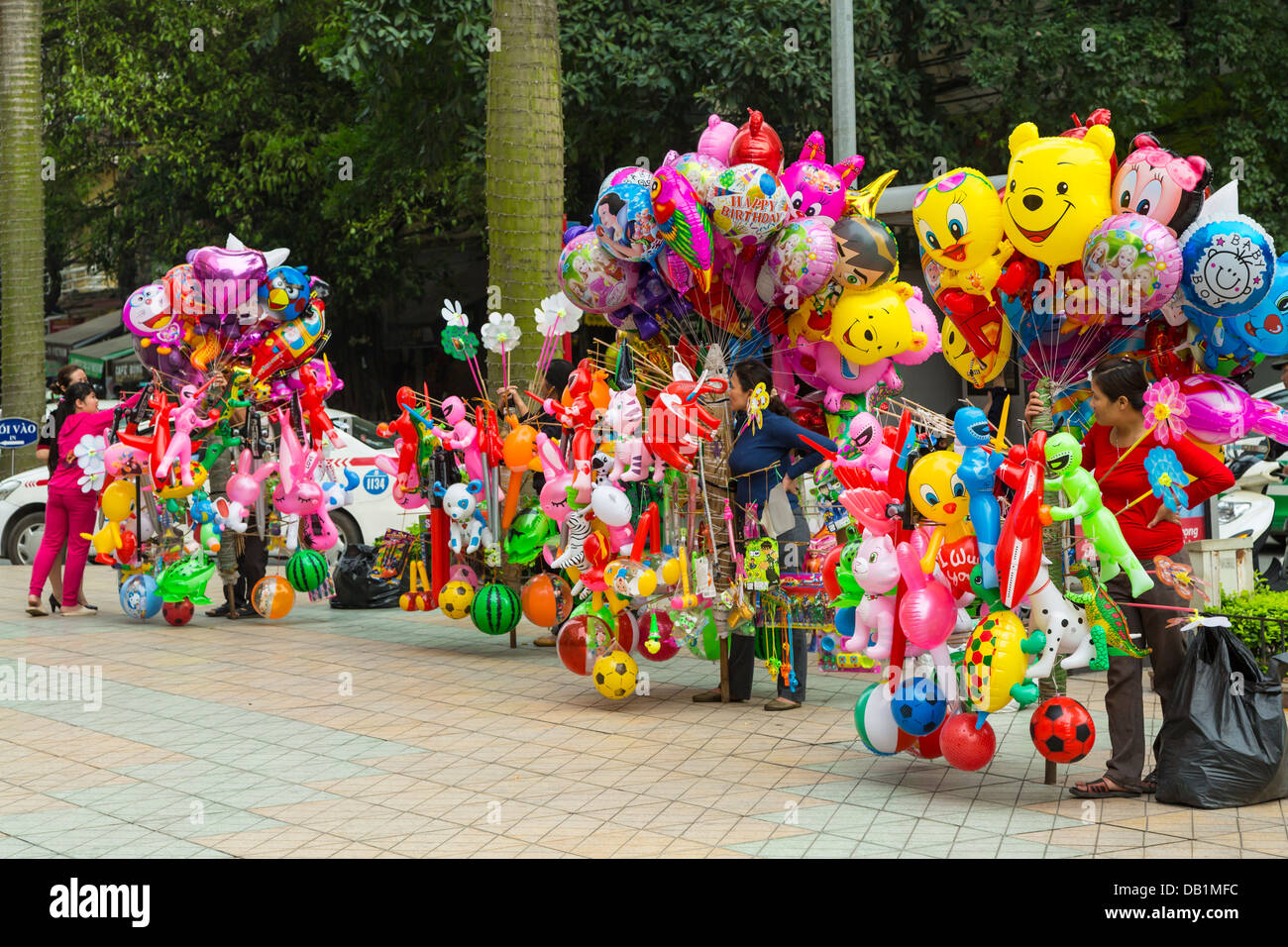 Selling party balloons on the street in Hanoi, Vietnam, Asia Stock ...