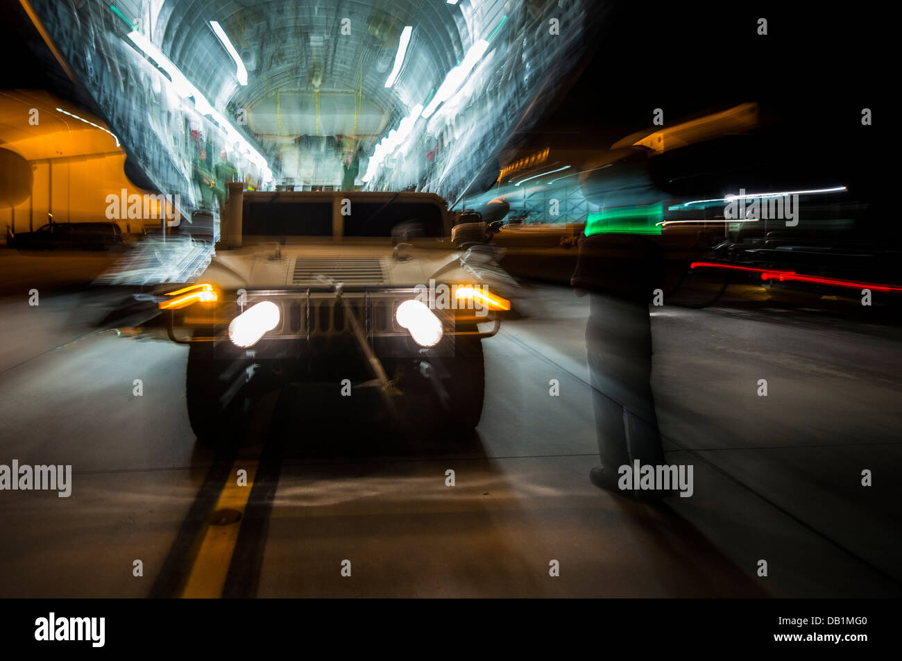 A Humvee is loaded onto a C-17 Globemaster III during an exercise to ...
