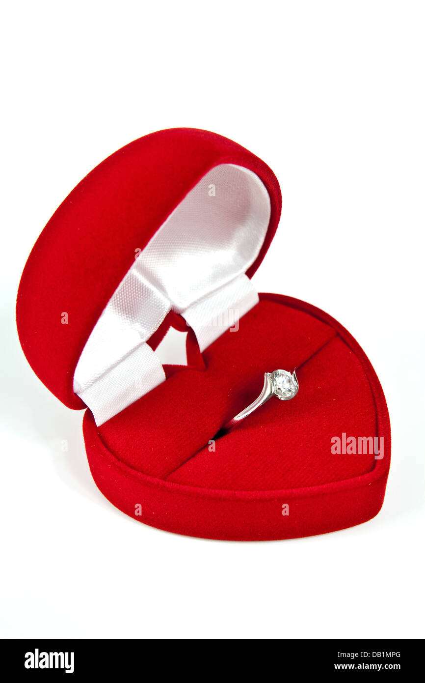 Red velvet box for an engagement ring on white background Stock Photo ...