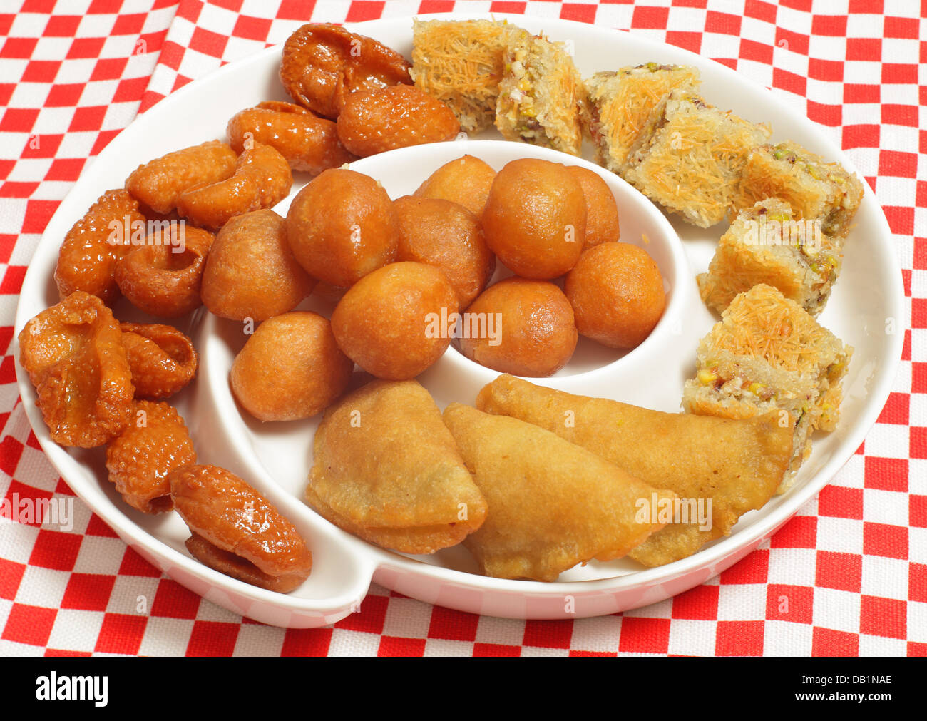 A plate of traditional Middle Eastern sweets that are particularly ...